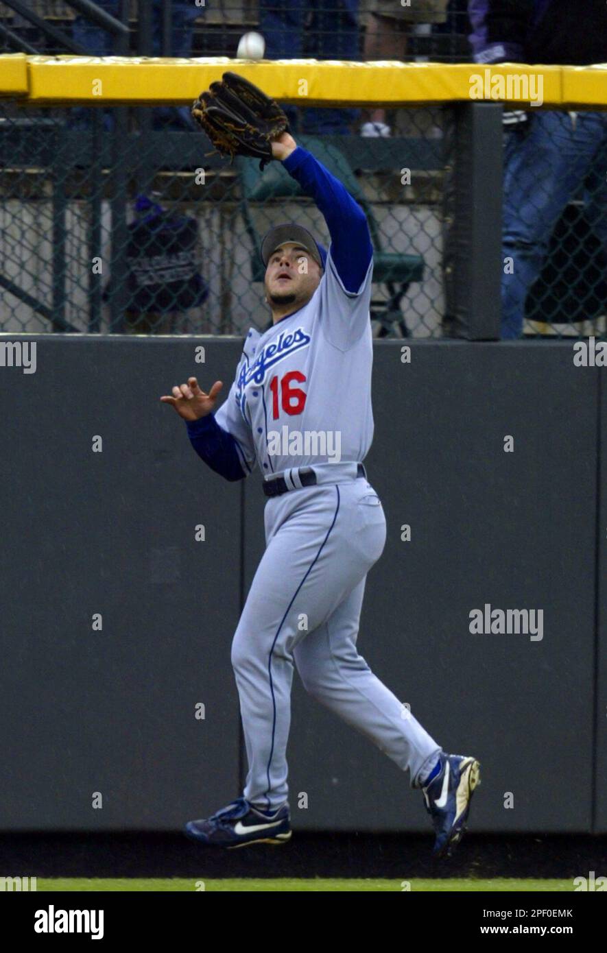 Los Angeles Dodgers outfielder Paul Lo Duca (16) grabs the ball on the ...