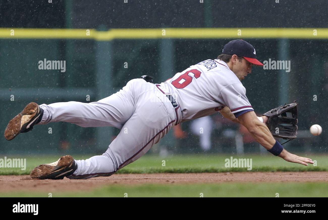 Atlanta Braves third baseman Mark DeRosa dives for a groundball hit by ...