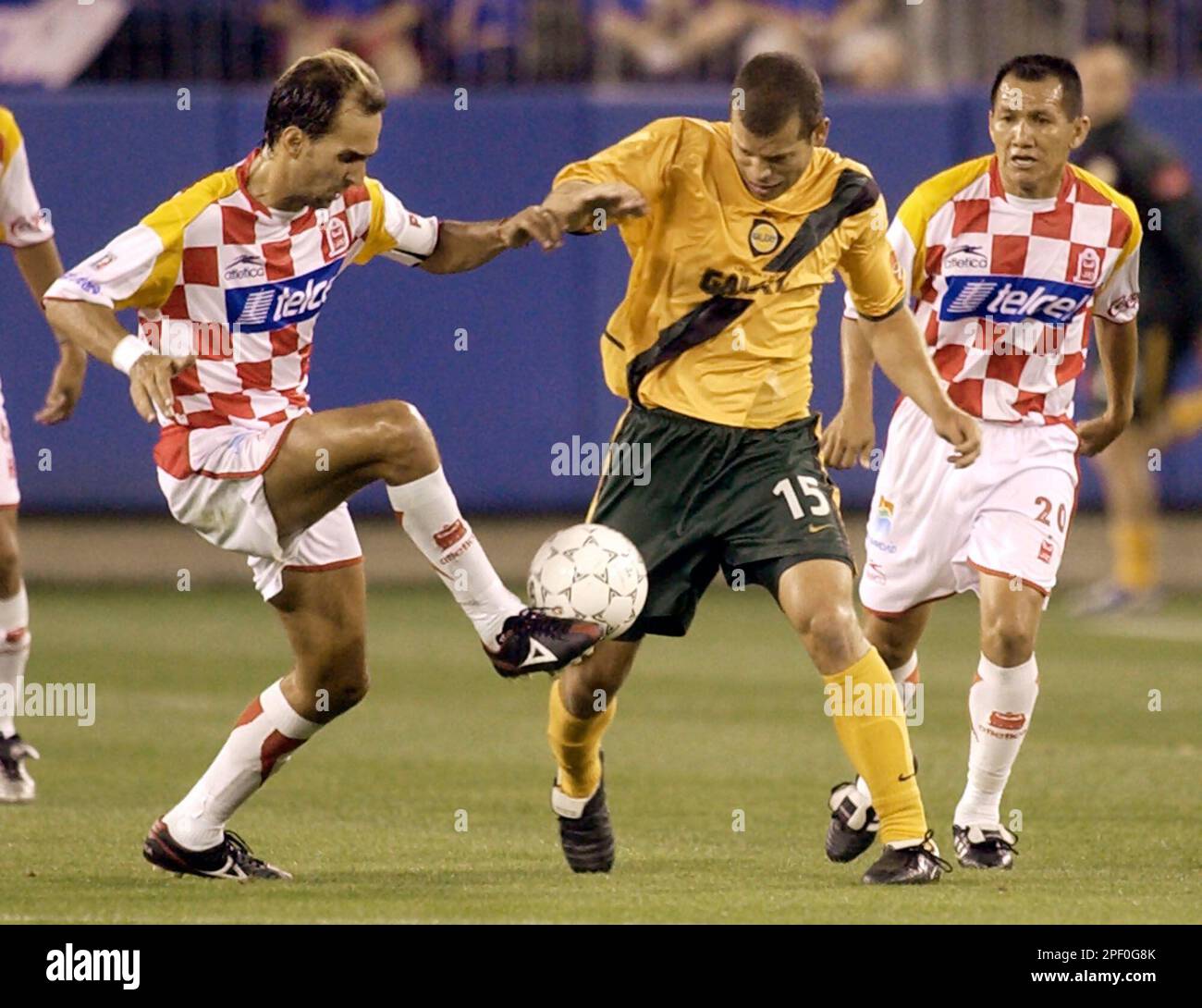 Tecos UAG's Flavio Davino, left, fights Los Angeles Galaxy's Alejandro ...