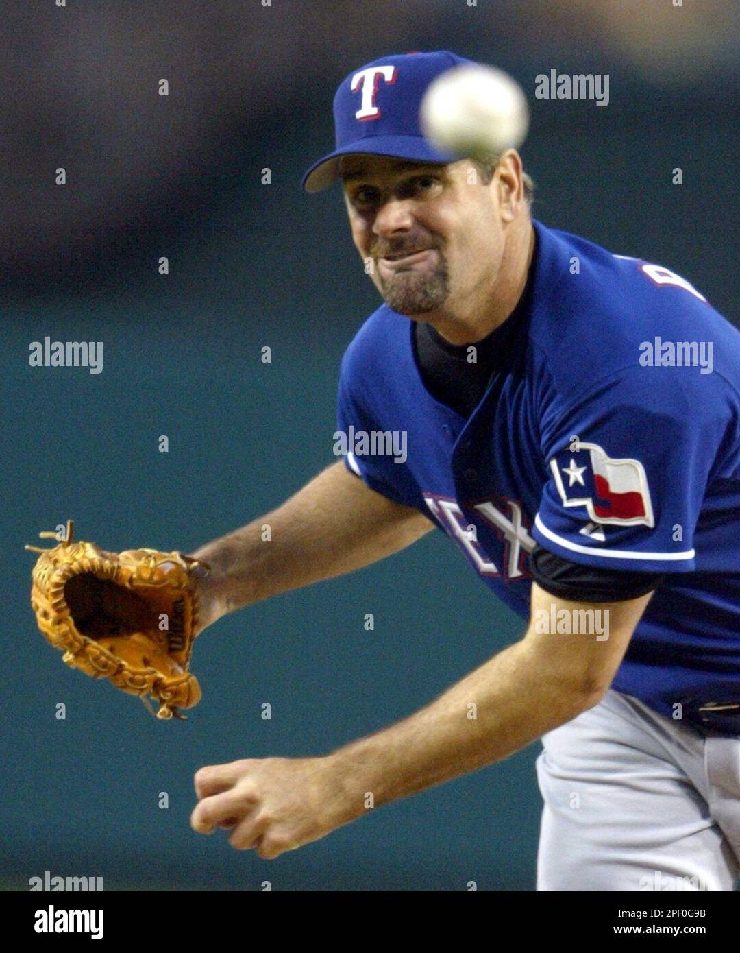 Texas Rangers starting pitcher Kenny Rogers throws to the Anaheim ...
