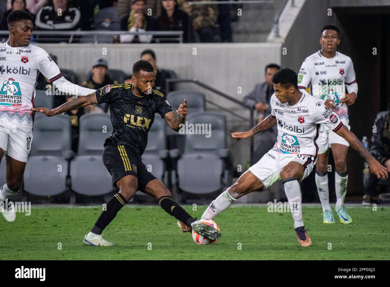 LAFC midfielder Kellyn Acosta (23) and Alajuelense defender Yael Lopez ...