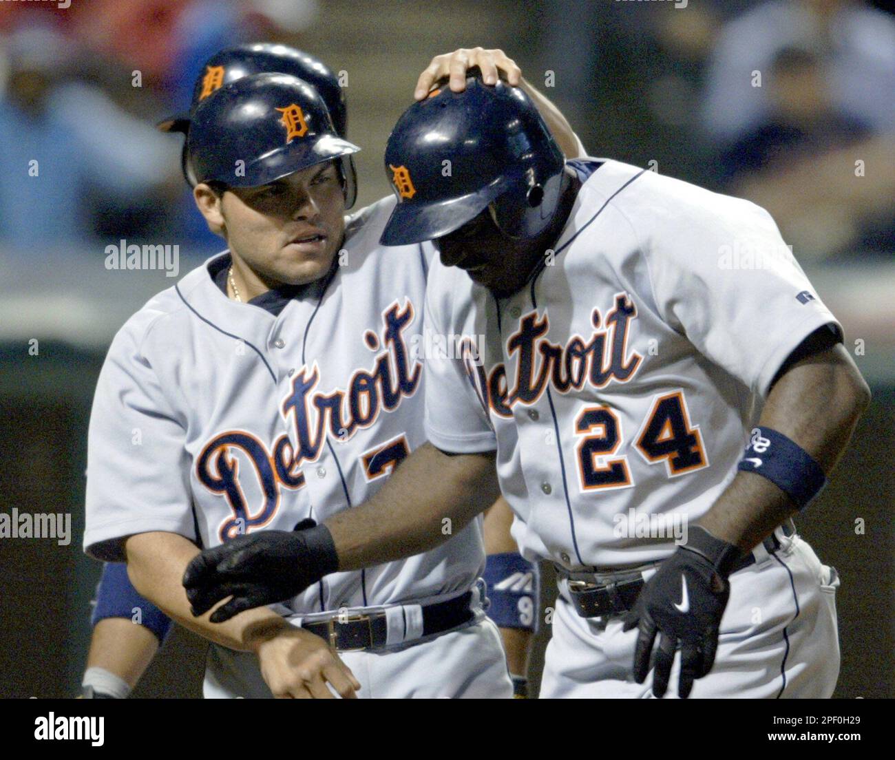 Detroit Tigers' Ivan Rodriguez, left, greets teammate Rondell White (24 ...