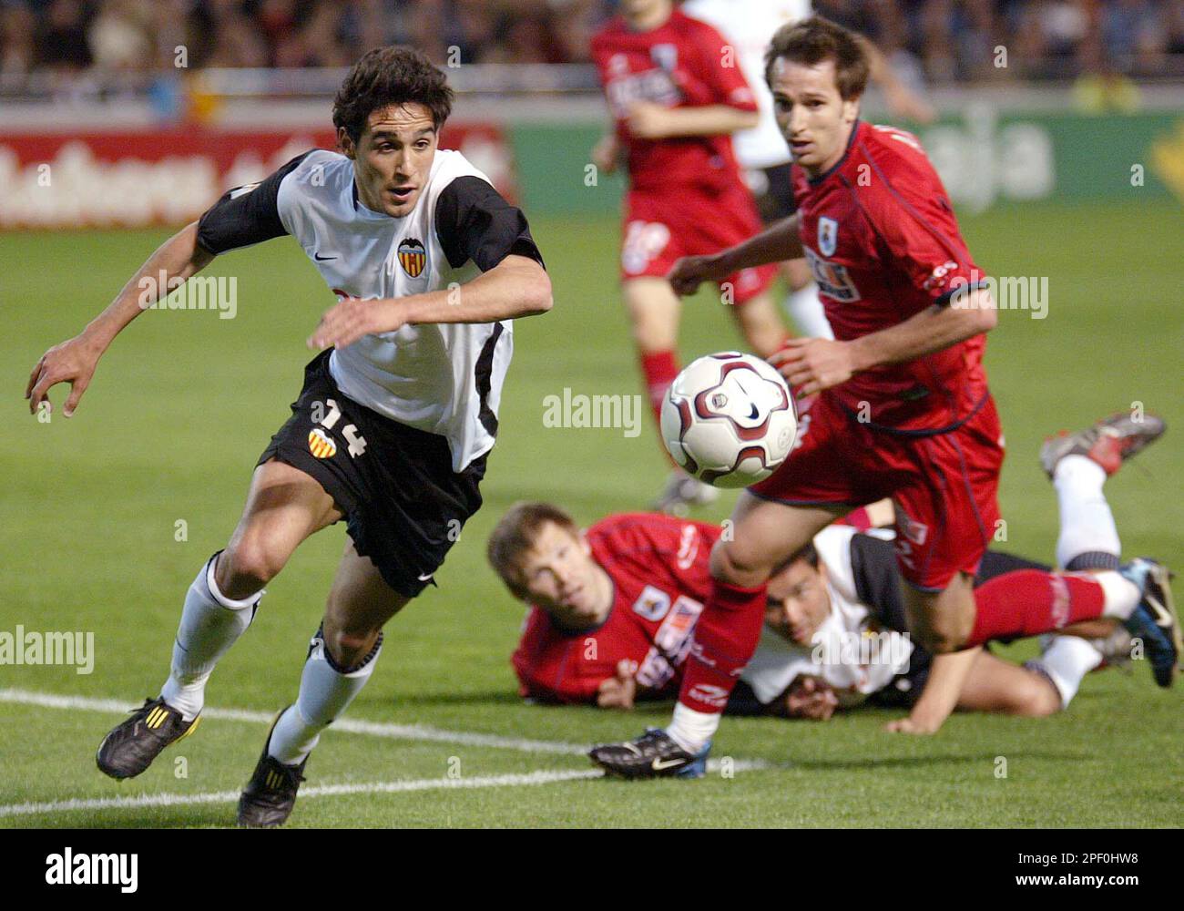 Valencia's Vicente Rodriguez, left , gets past Real Sociedad's Aitor ...