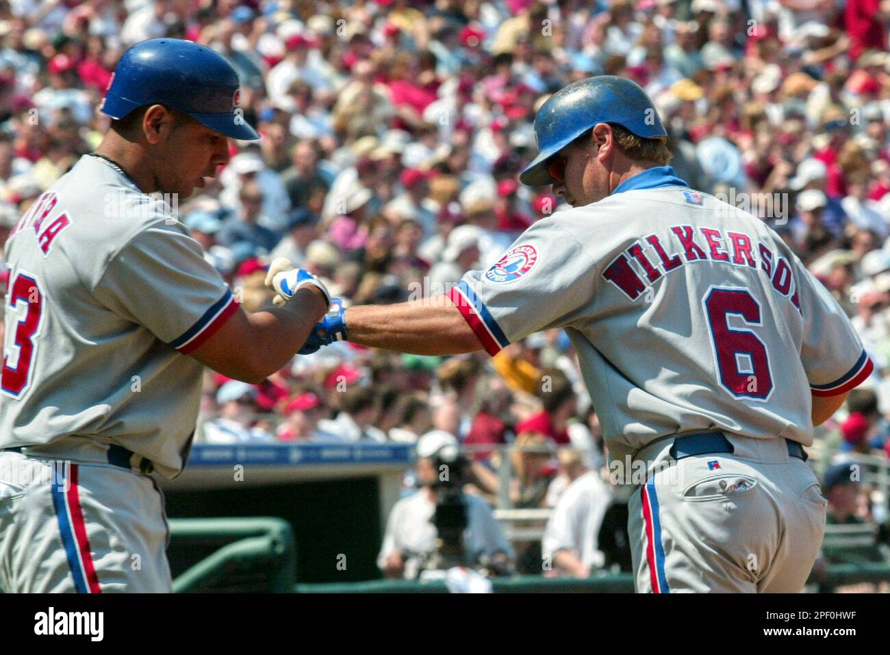 Montreal Expos' Brad Wilkerson (6) gets congratulations from Juan ...
