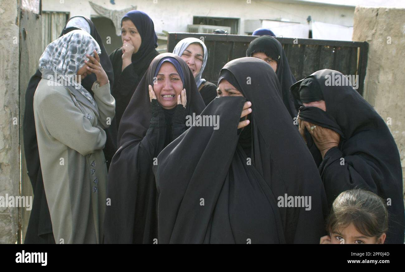 Iraqi women weep during the funeral procession for Iraqi man Ali Yonis ...