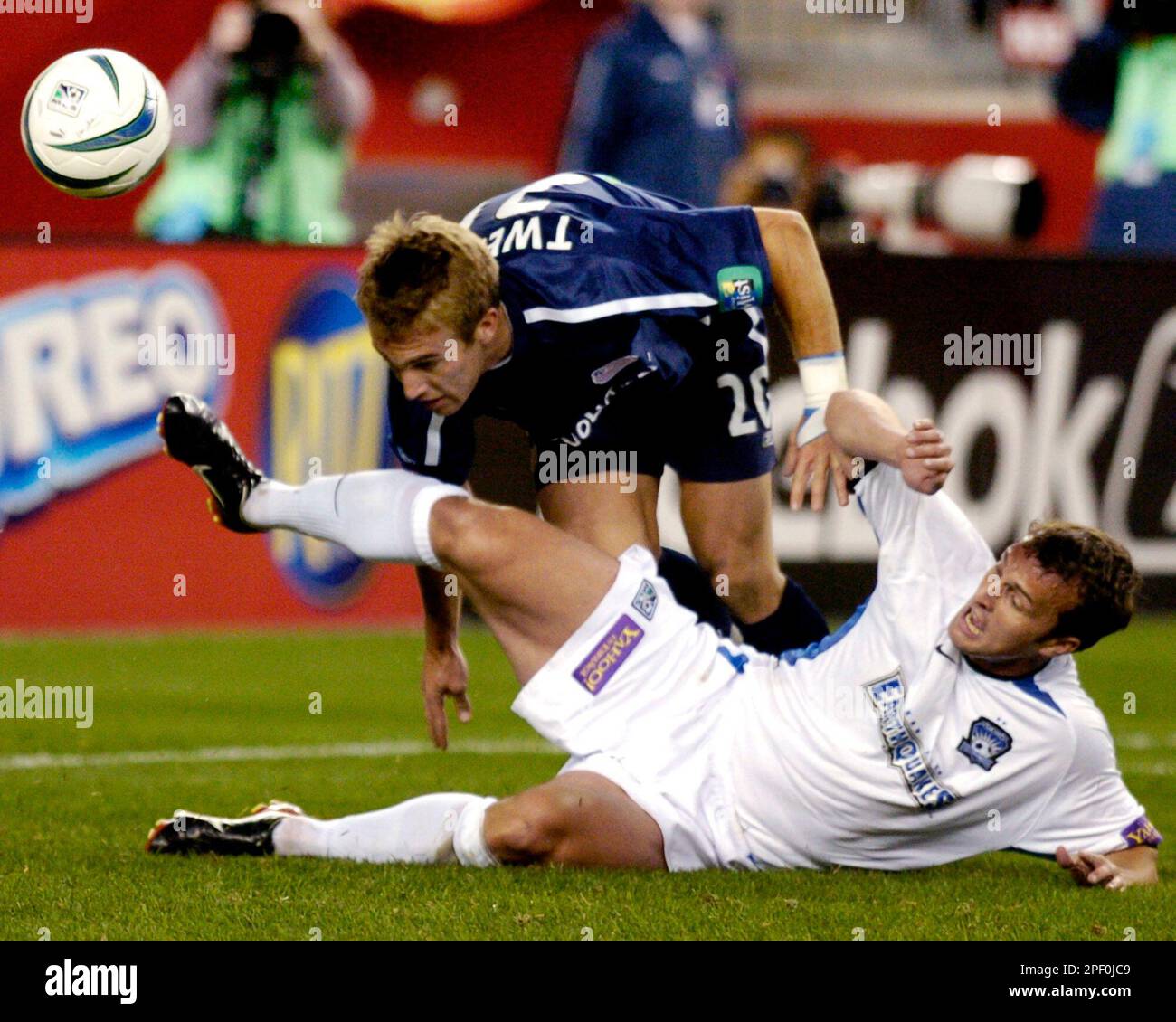 New England Revolution forward Taylor Twellman (20) heads the ball over ...