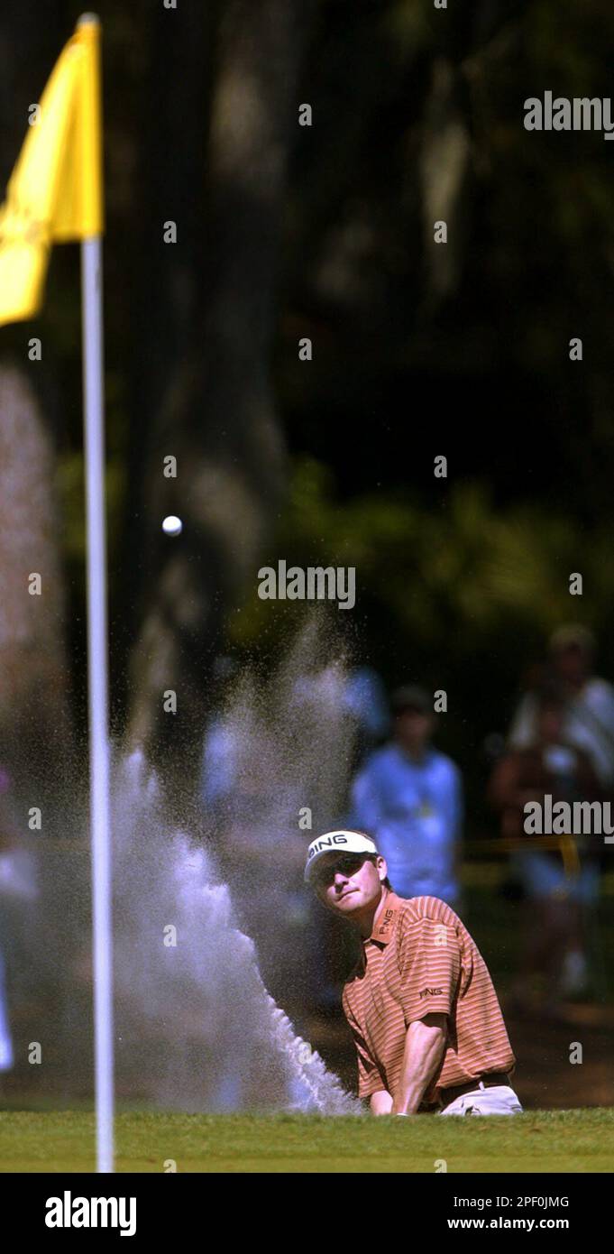 Heath Slocum hits out of the trap on the seventh green during the third ...