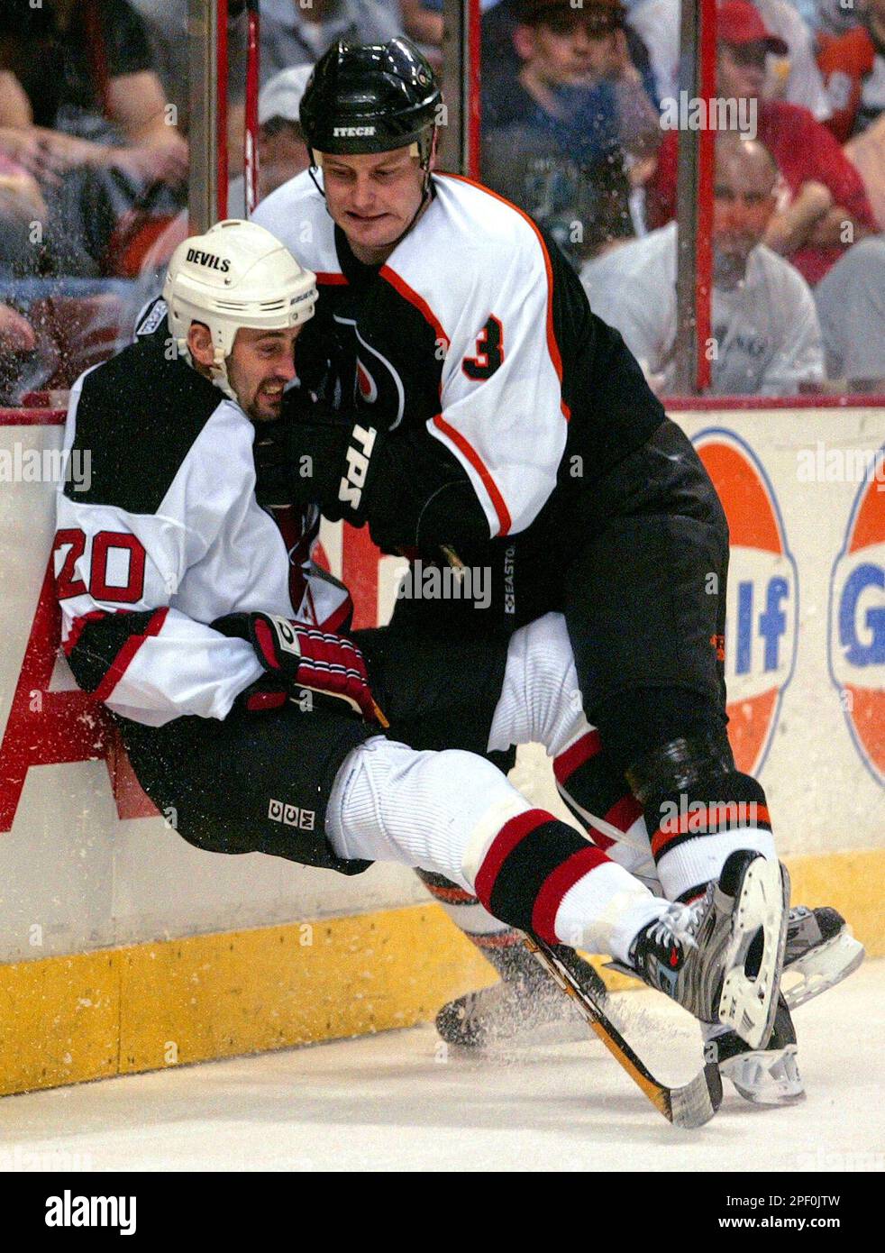 Philadelphia Flyers' Mattias Timander of Sweden checks New Jersey ...