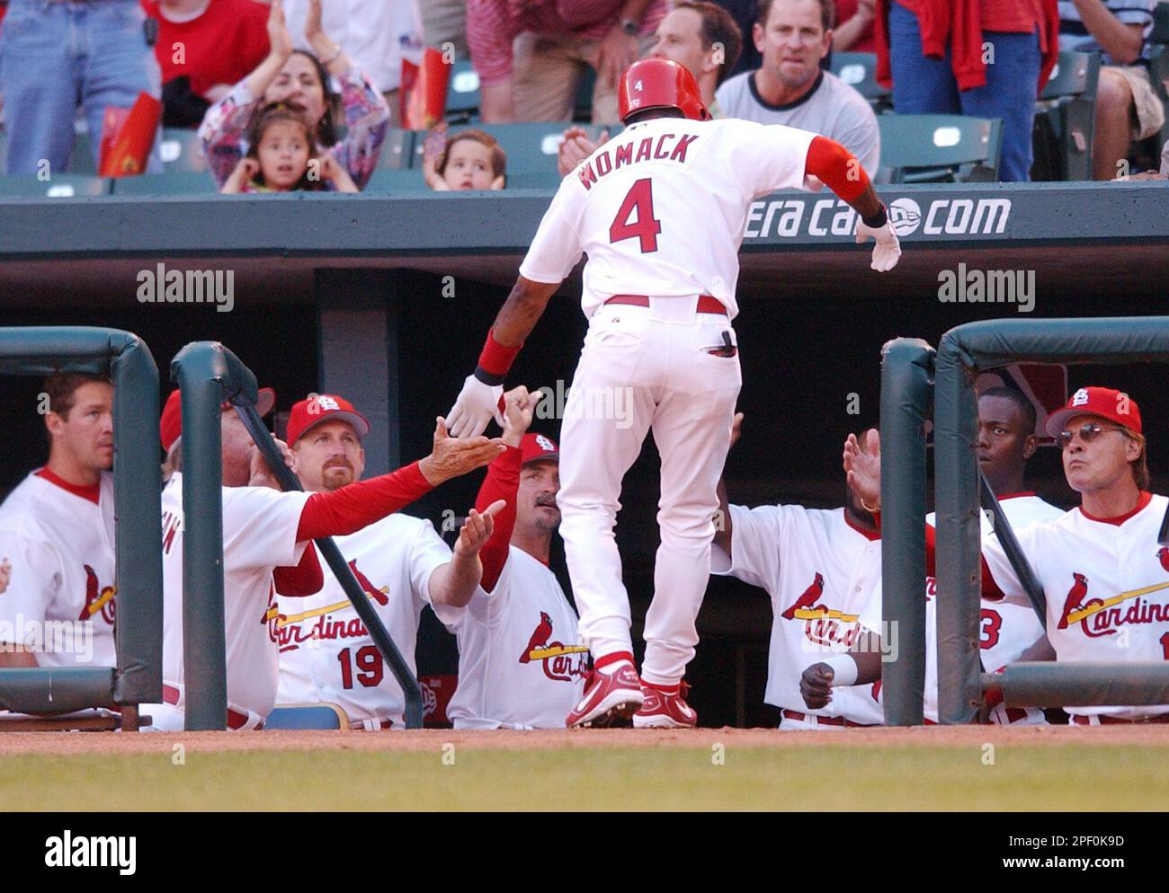 St. Louis Cardinals' Tony Womack is congratulated by teammates as he ...