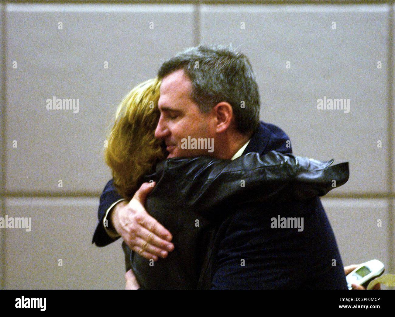 Clare Rochester hugs her brother Michael Blagg during his murder trial ...