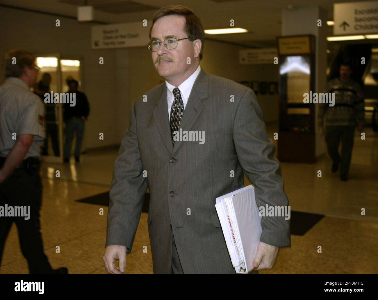 Deputy D.A. David Harris leaves the San Mateo Co. Hall of Justice after ...