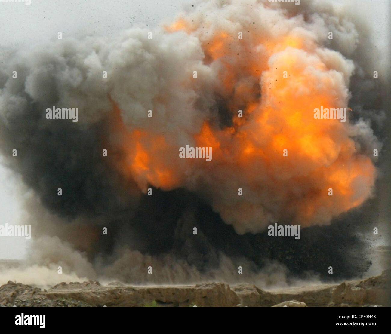 A large cache of weapons and explosives is destroyed by U.S. Marines a ...
