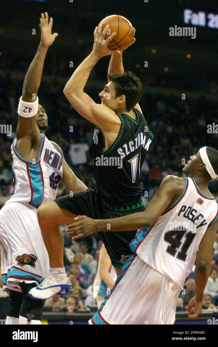 Minnesota Timberwolves' Wally Szczerbiak, center, gets past Memphis ...