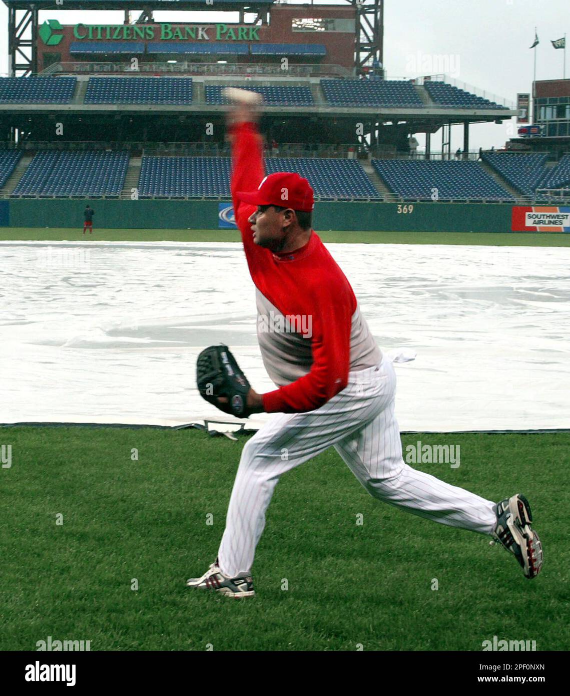 Philadelphia Phillies pitcher Vicente Padilla warms up for the ...