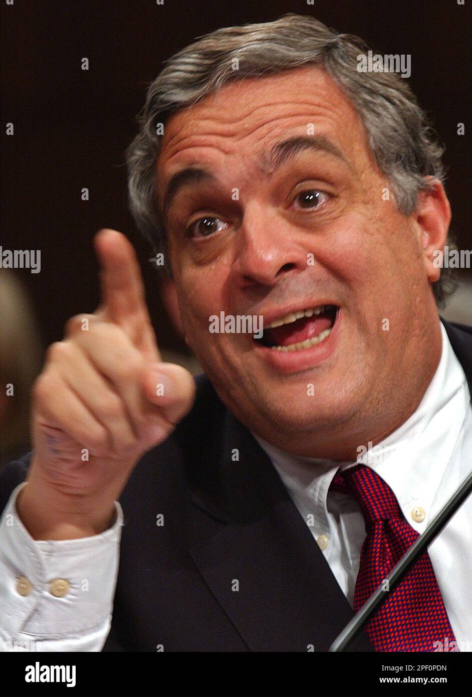 Director of the Central Intelligence Agency George Tenet answers a ...