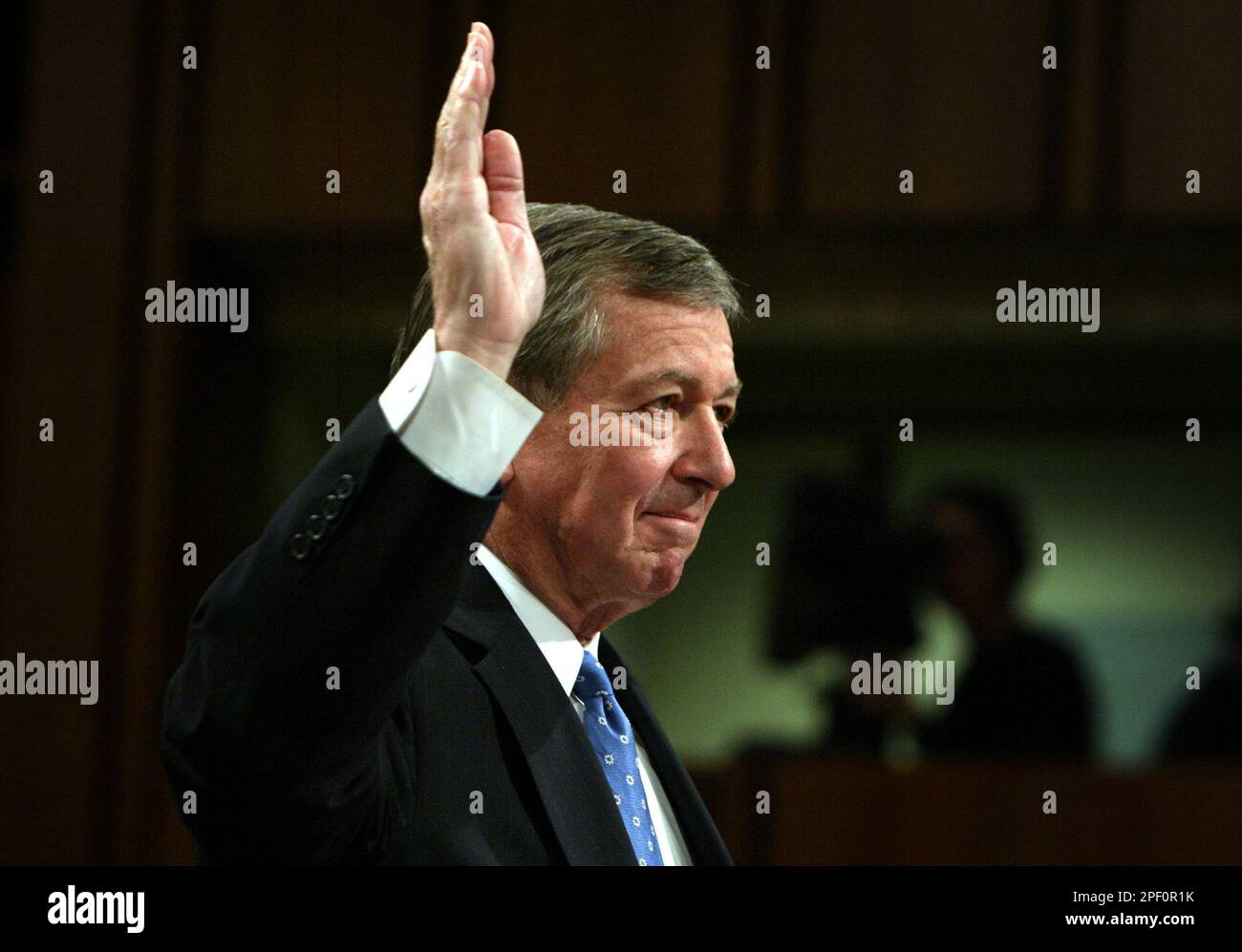 U.S. Attorney General John Ashcroft is sworn in before the commission ...