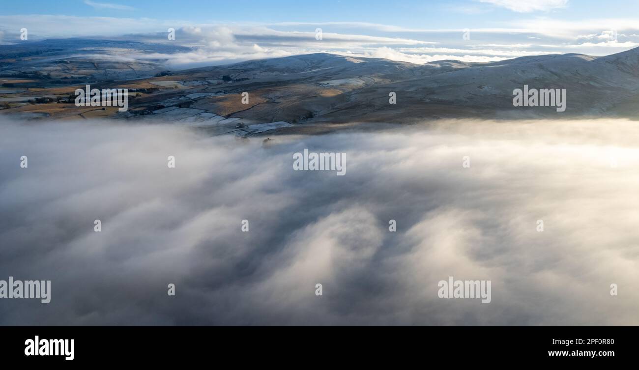 Cloud inversion above the Cumbrian village of Raven Stonedale on a cold ...