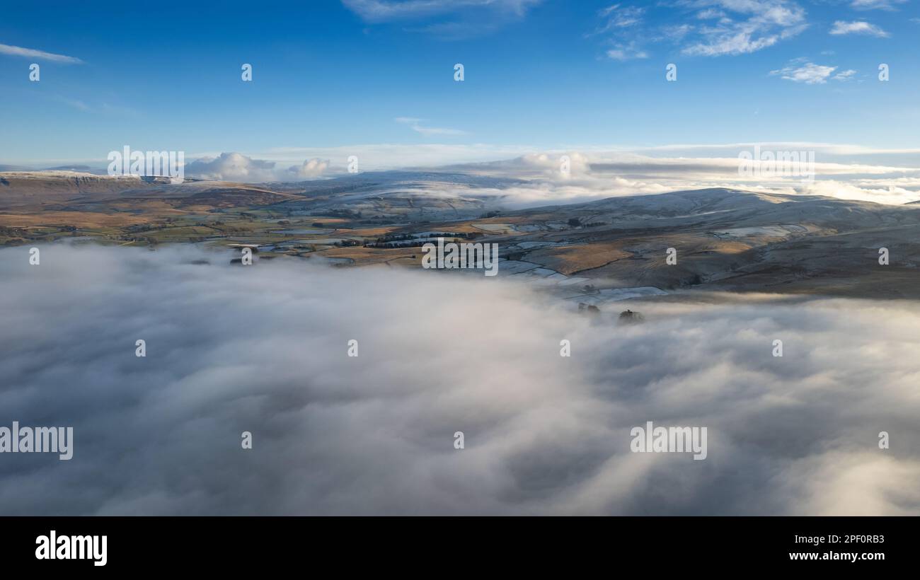 Cloud inversion above the Cumbrian village of Raven Stonedale on a cold ...