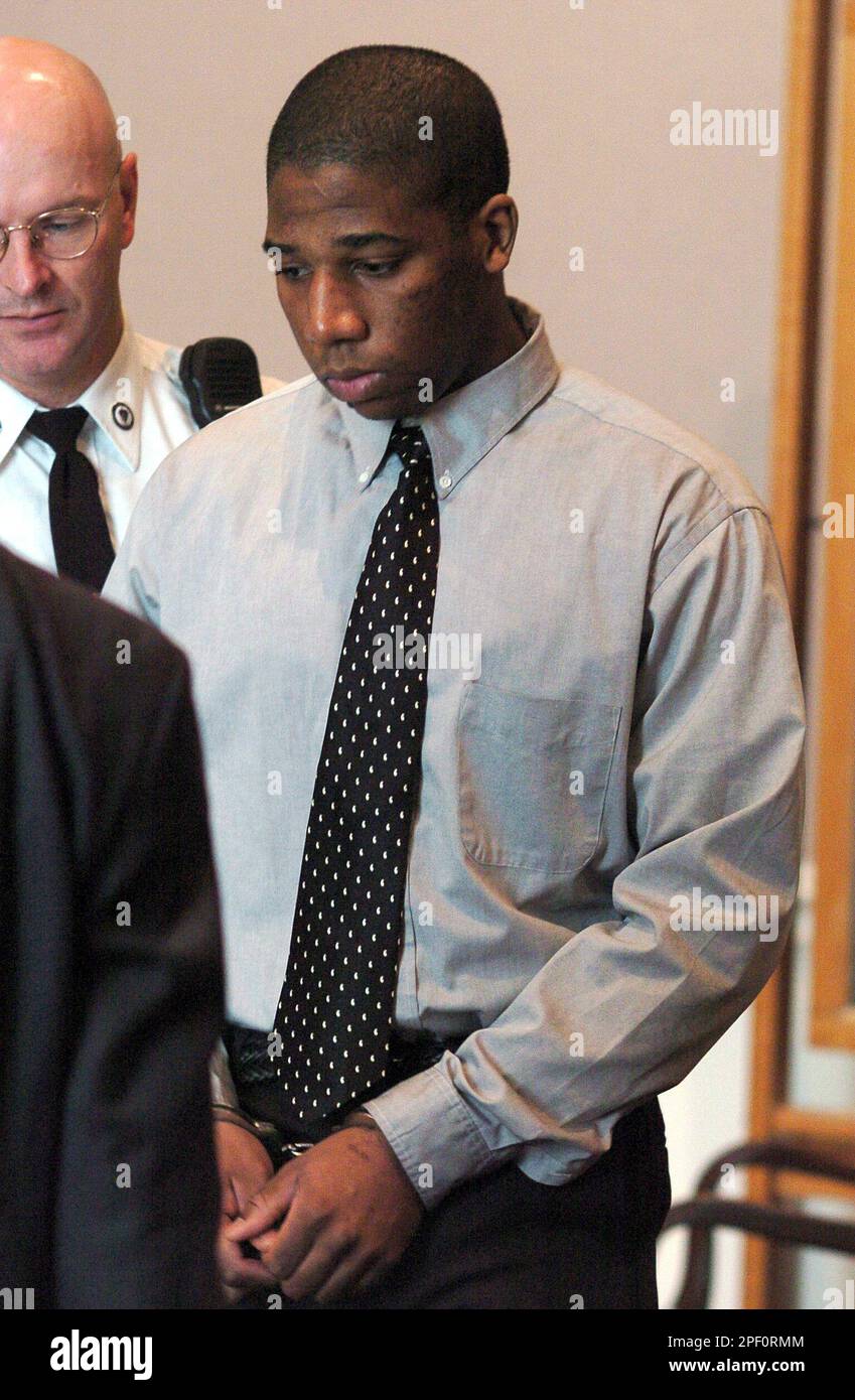 Kyle Bryant, 22, is led to the defense table in handcuffs during ...