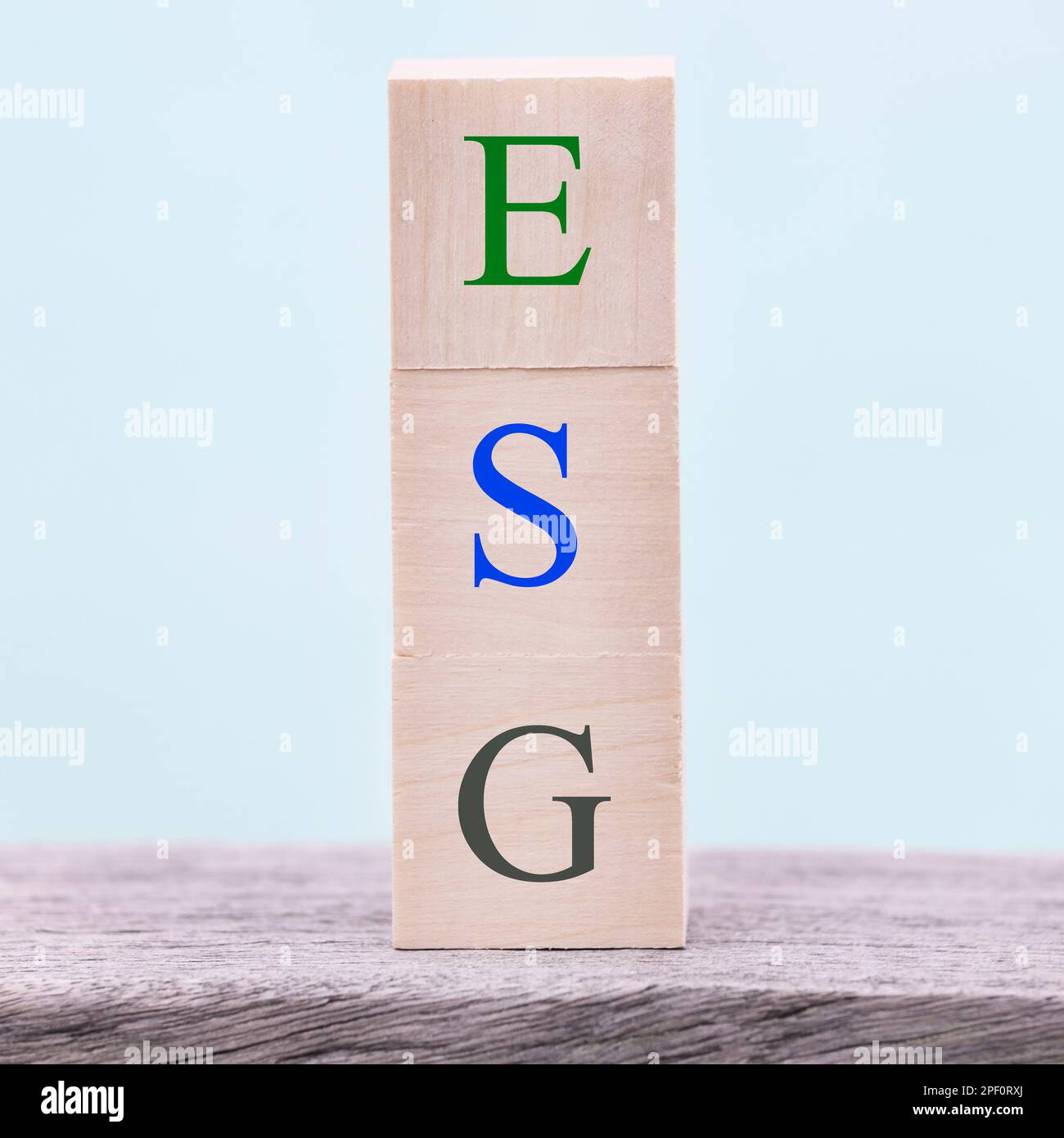 ESG words on wooden cube on blue background.copy space. Environmental ...