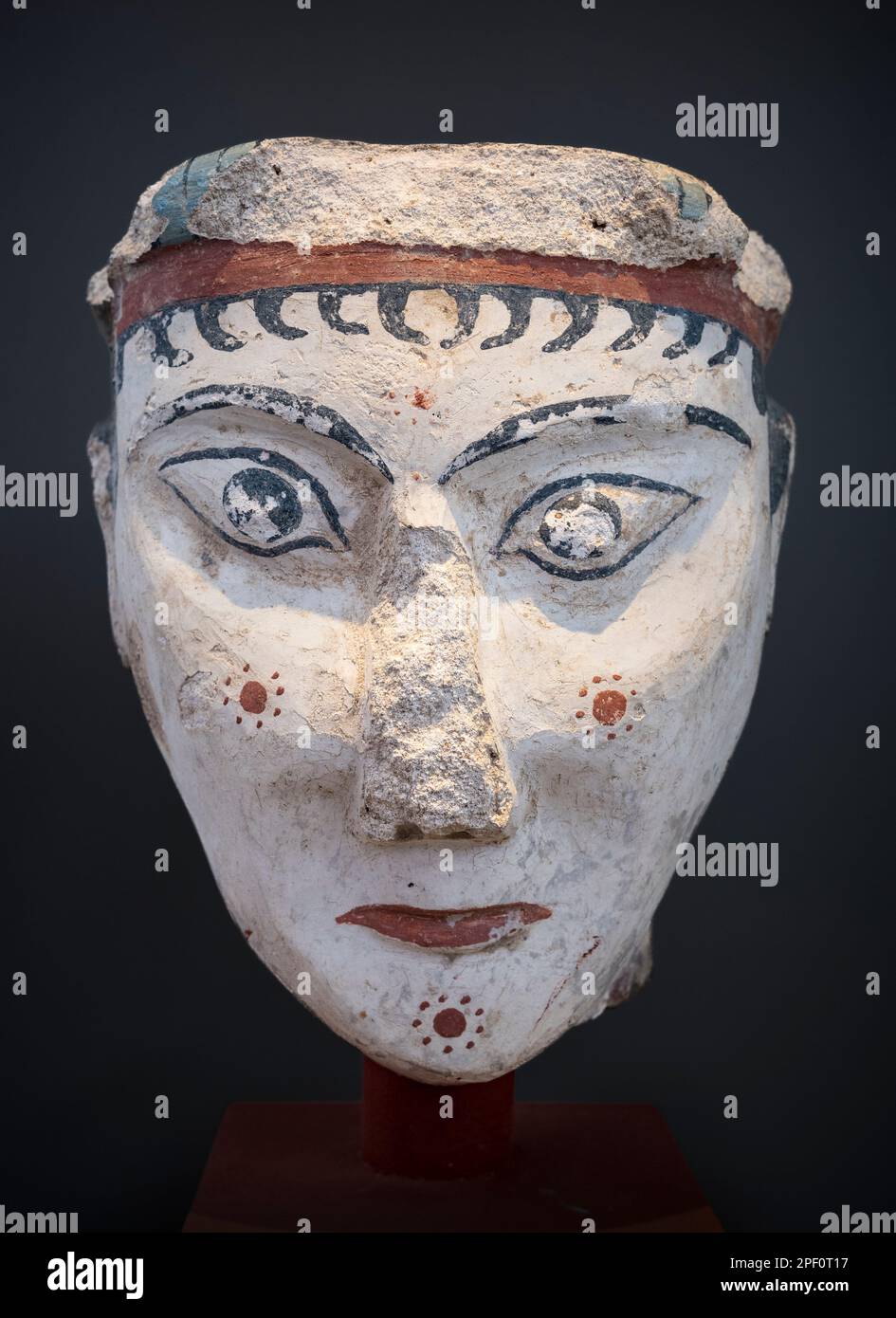 Plaster head of a woman with painted decoration, possibly a goddess or ...