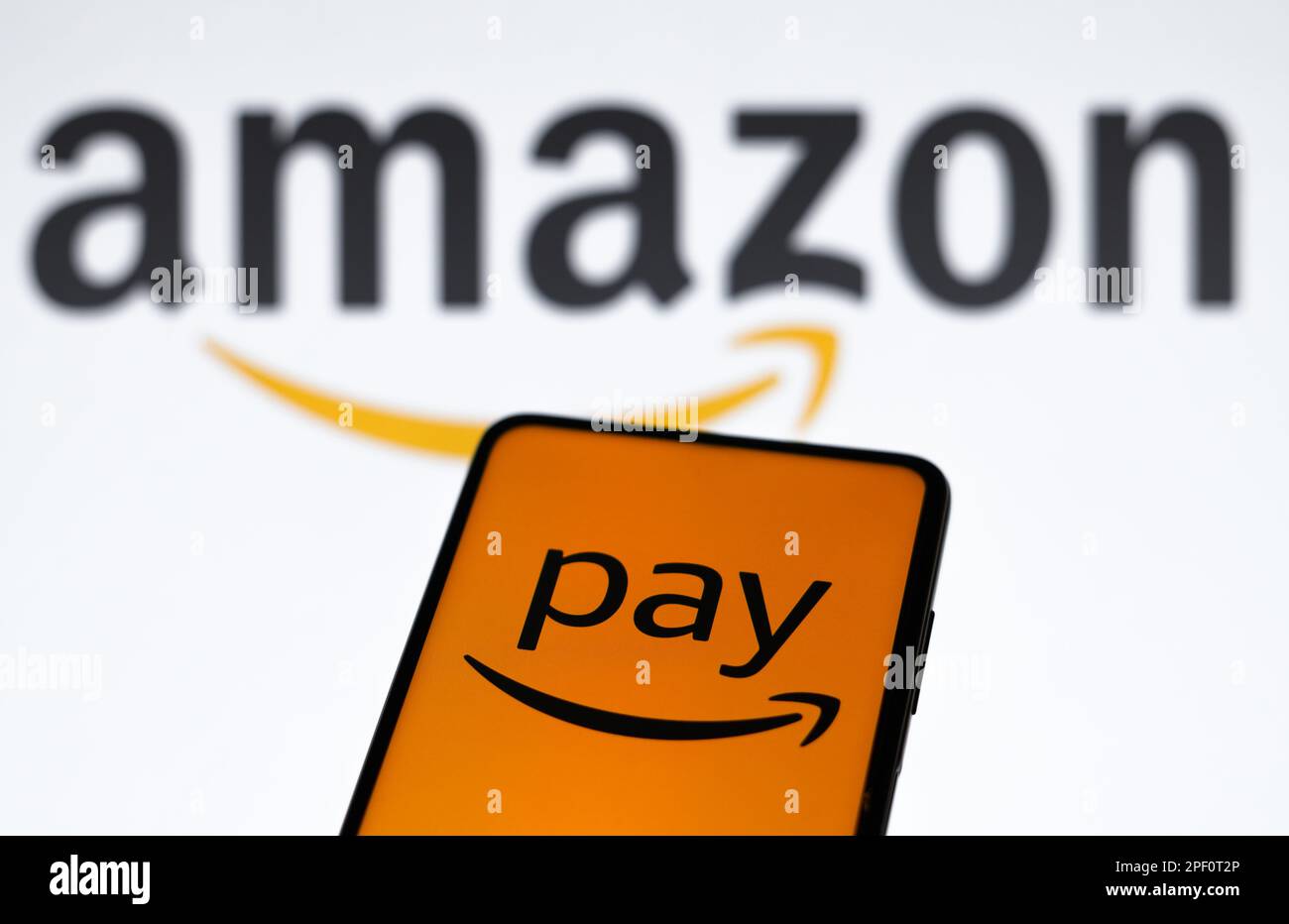 In this photo illustration the Amazon Pay logo seen displayed on a ...