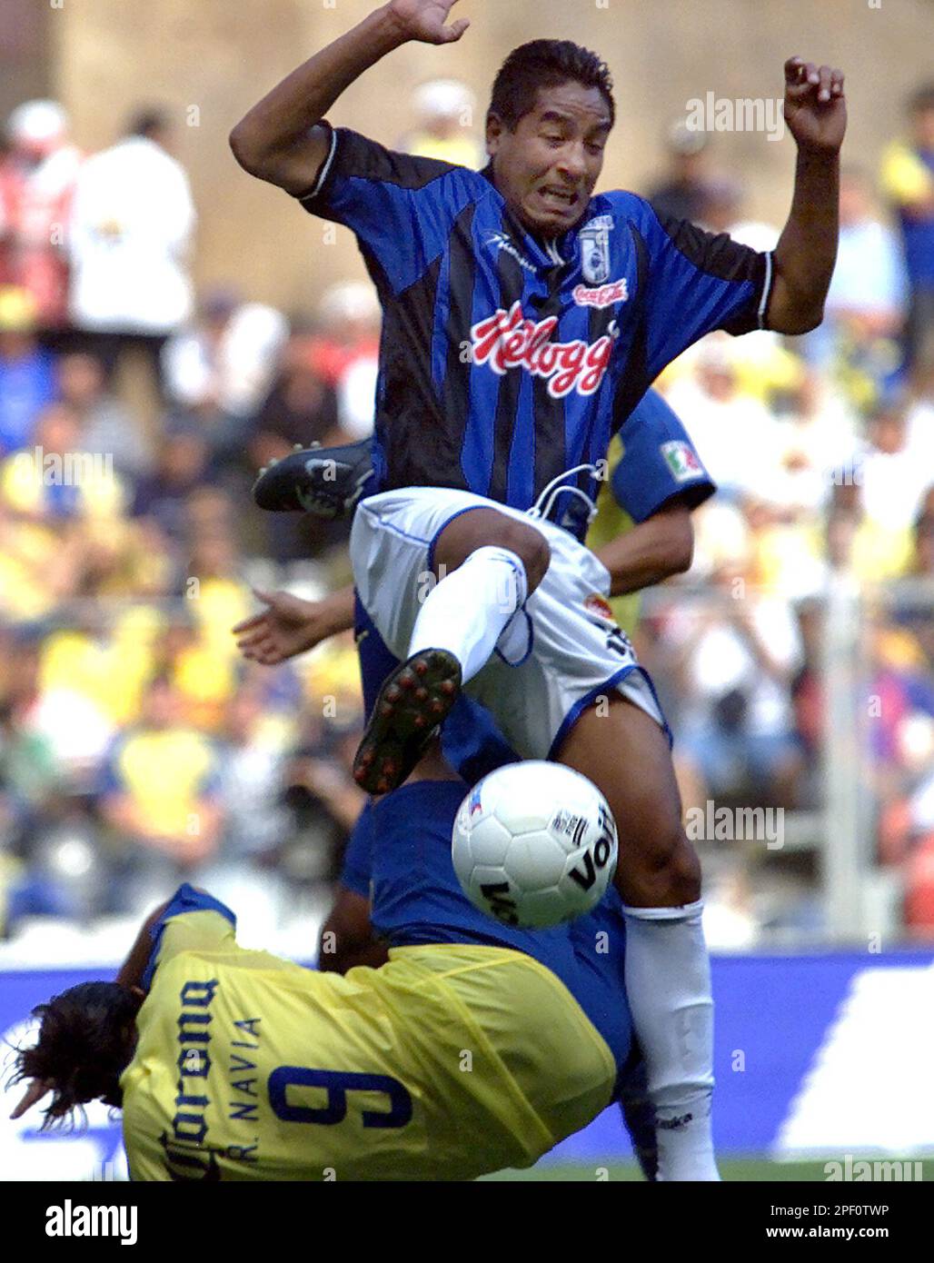 Queretaro's Jesus Lopez, top, fights for the ball with America's ...