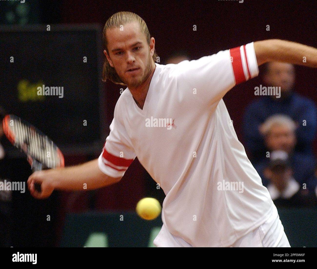 Belgium's Xavier Malisse returns the ball towards Zimbabwe's Wayne ...