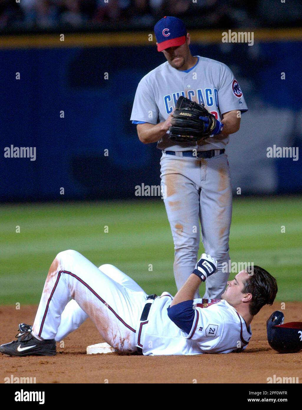 Atlanta Braves' Jaret Wright lays safe at the feet of Chicago Cubs ...