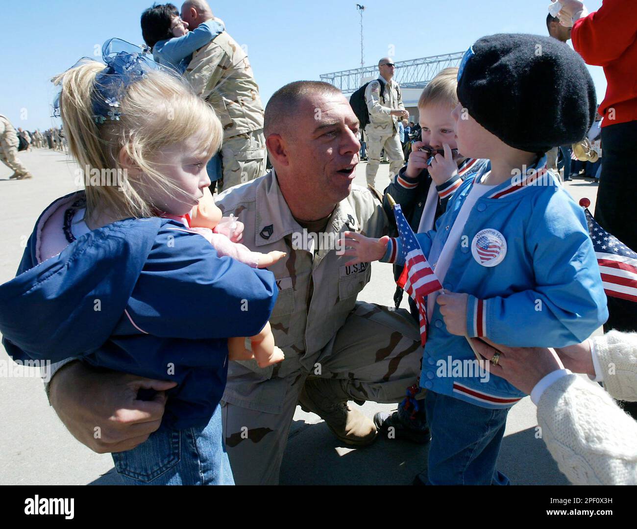 Sgt. Tom Burdick of Warwick, R.I. is greeted by his four-year-old ...