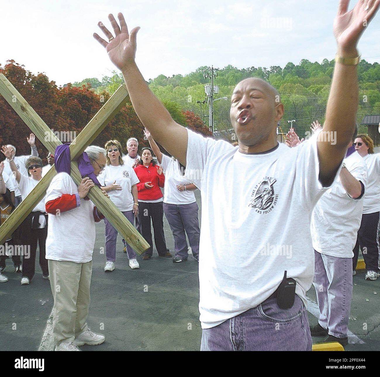 Pastor Rodney Montgomery, front, right, prays as a group of Christians ...