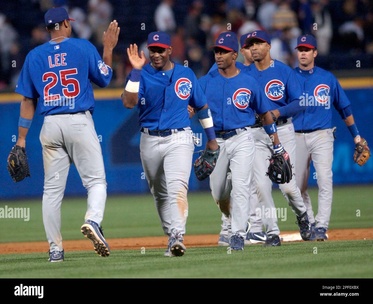 Chicago Cubs' Derrek Lee, left, congratulates Sammy Sosa as other ...