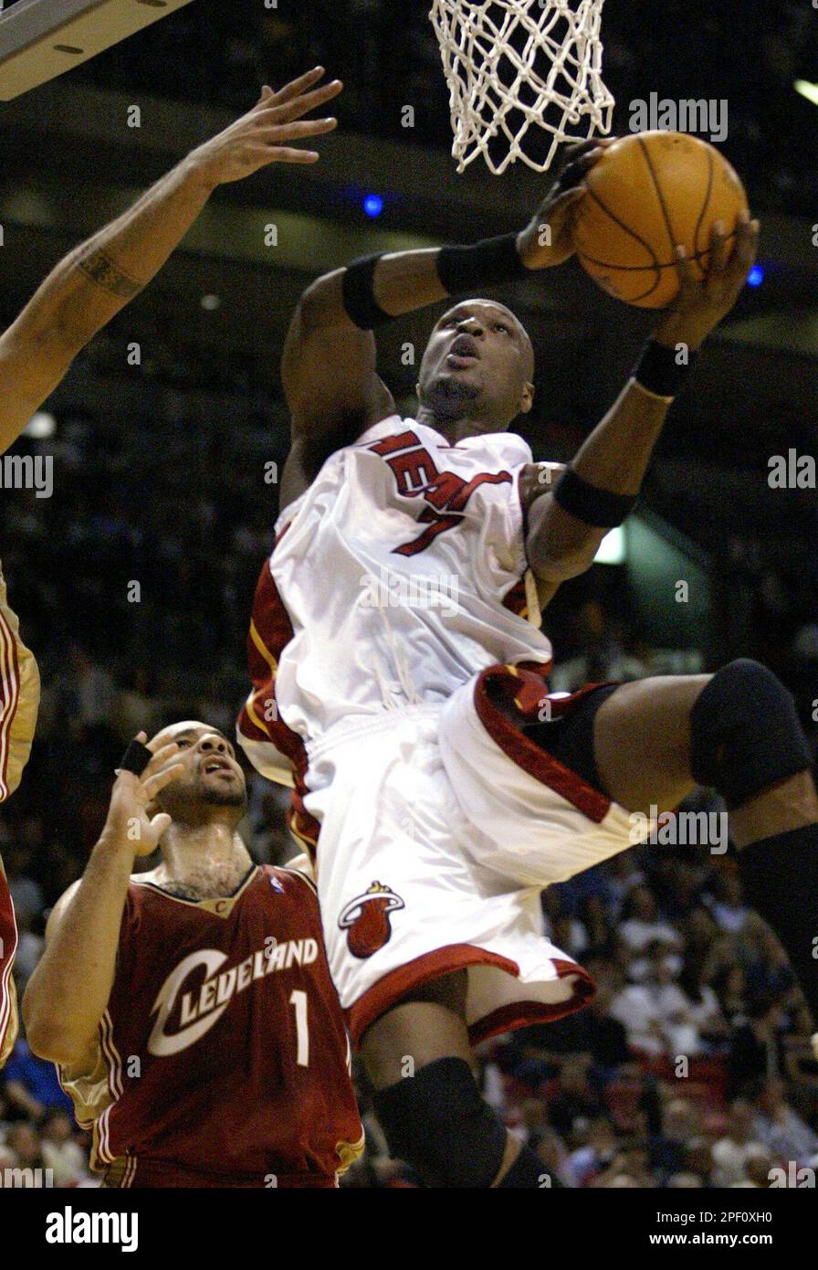 Miami Heat forward Lamar Odom drives toward the basket around Cleveland ...