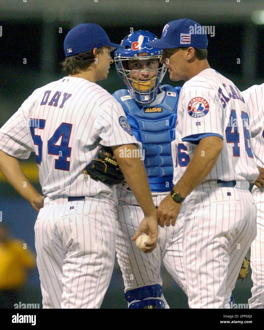 Montreal Expos coach Randy St. Claire (46) talks to pitcher Zach Day ...