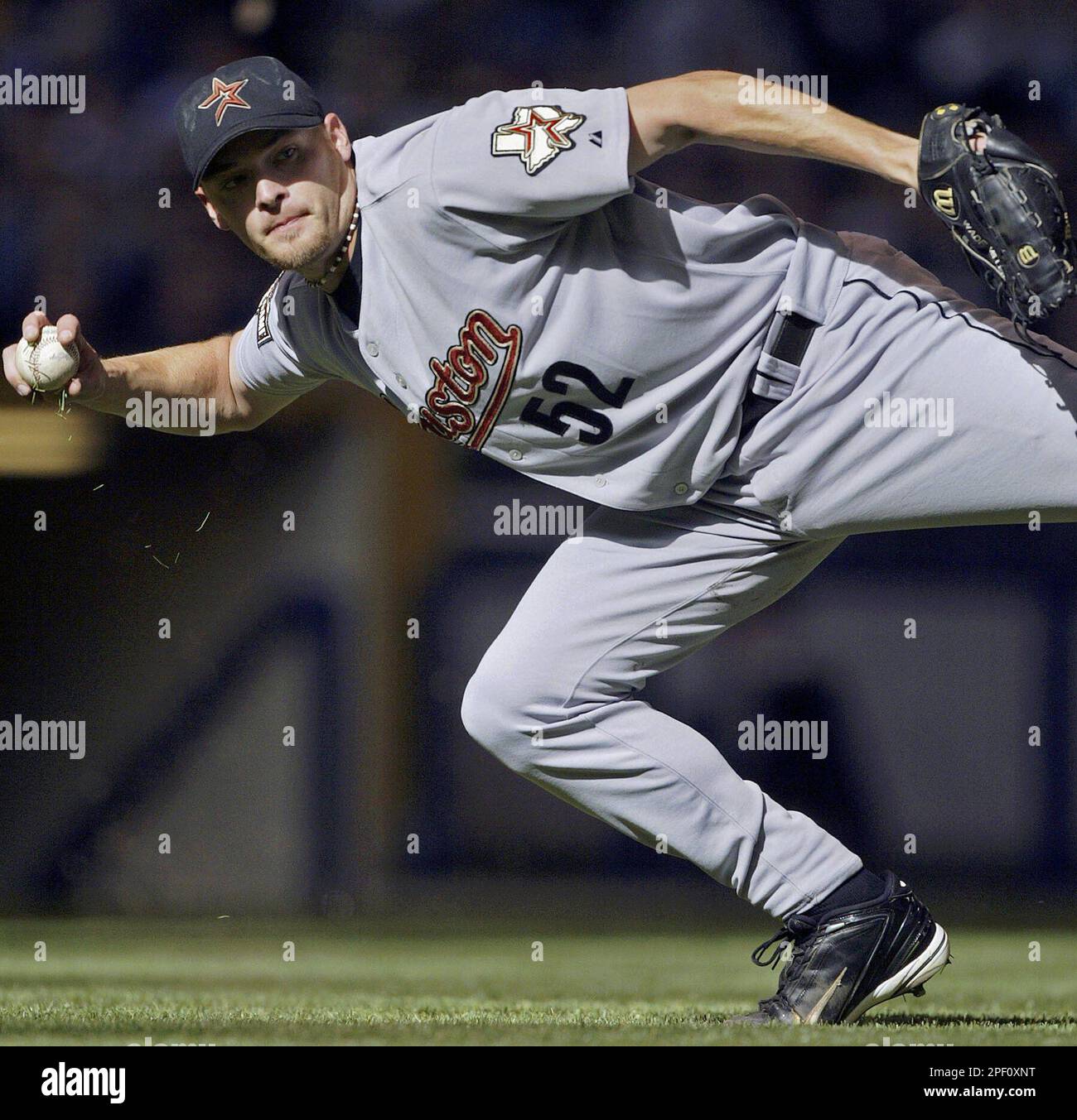 Houston Astros pitcher Wade Miller fields a bunt by Milwaukee Brewers ...