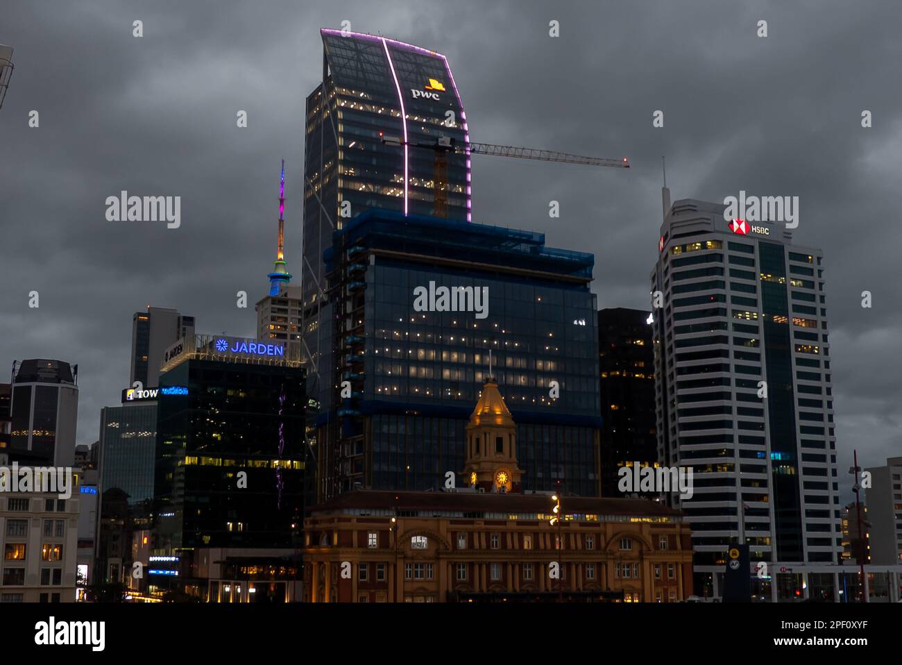 A nighttime shot of the Auckland waterfront including the downtown ...