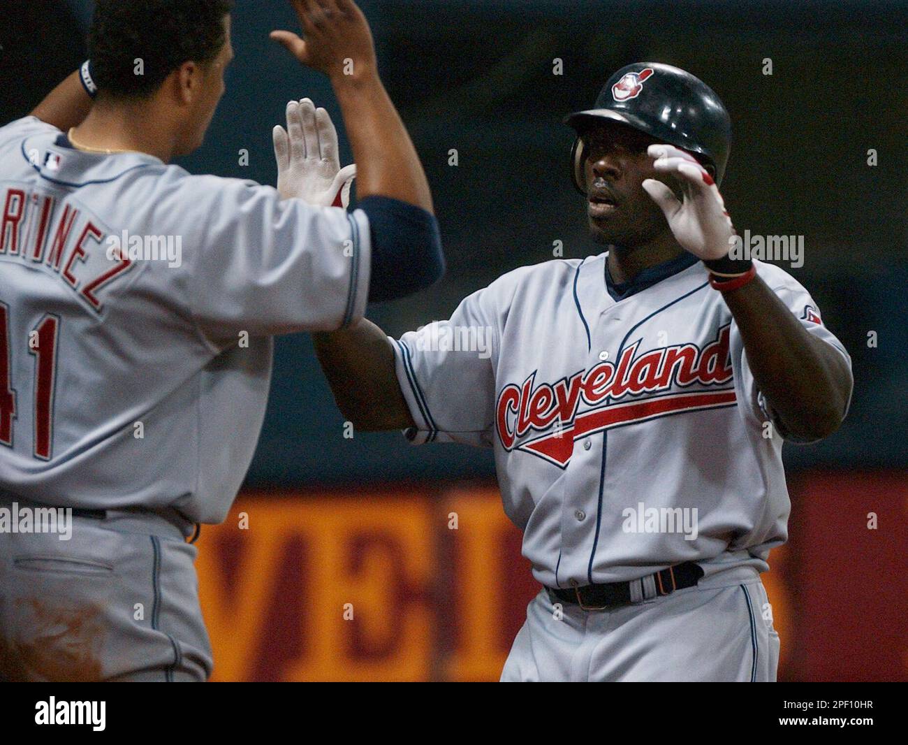 Cleveland Indians' Victor Martinez, left, welcomes teammate Matt Lawton ...
