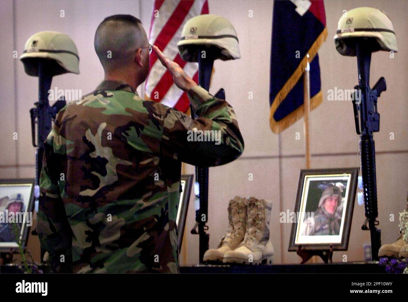 Lt. Col. Leo Quintas salutes five fallen soldiers at Fort Riley, Kan ...