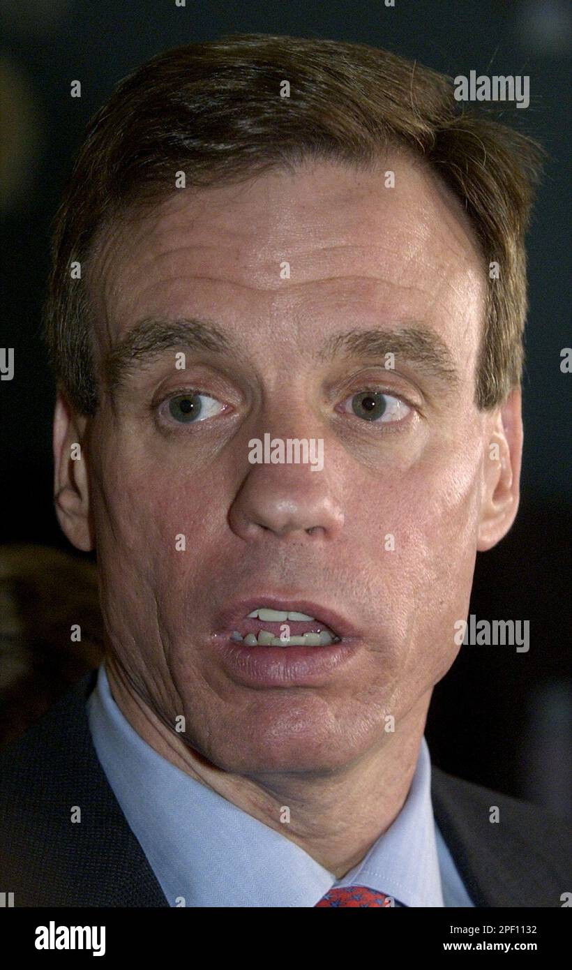 Virginia Gov. Mark R. Warner speaks with reporters outside his office ...