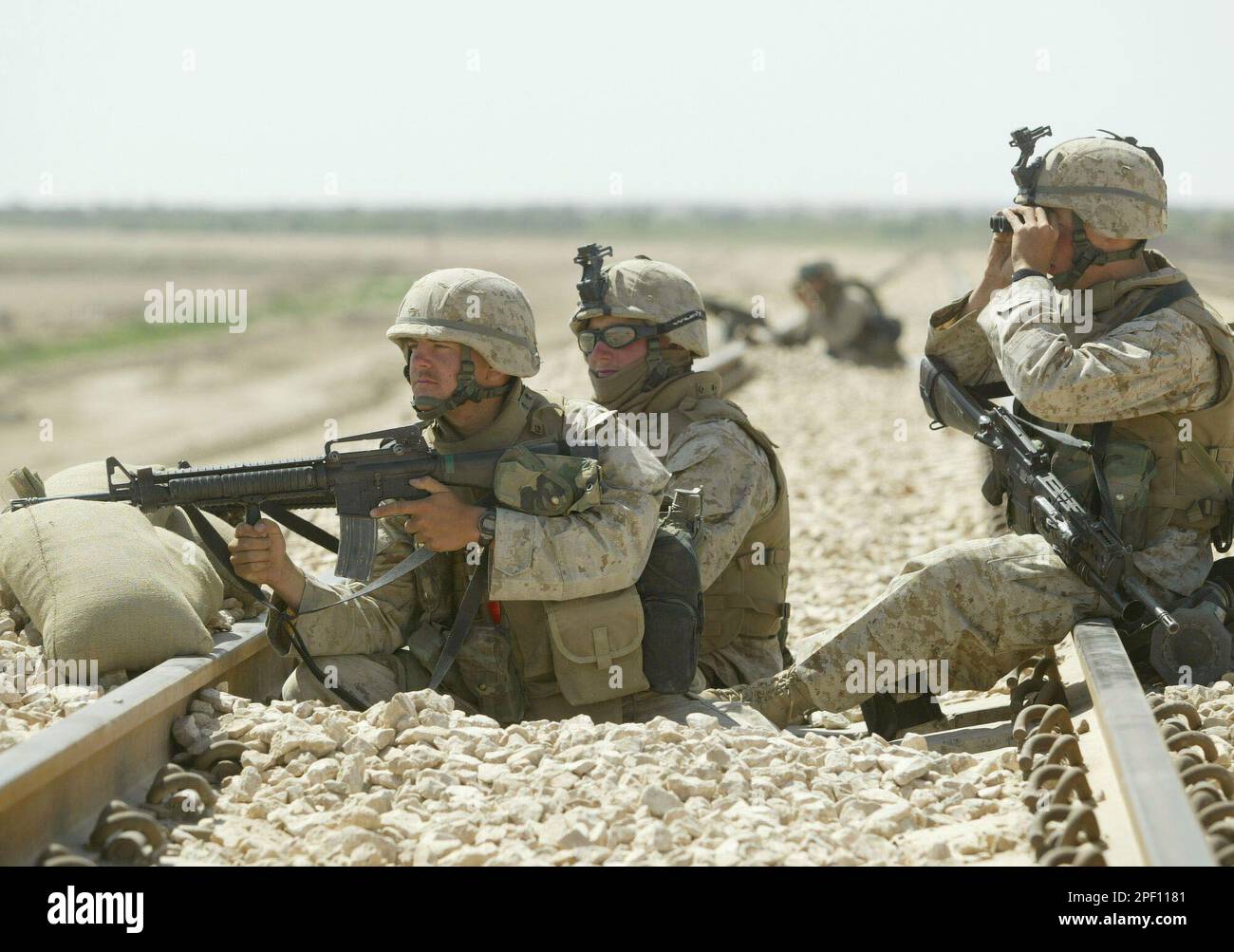 U.S. Marines with the 2nd Battalion 1st Marine Regiment stand guard at ...