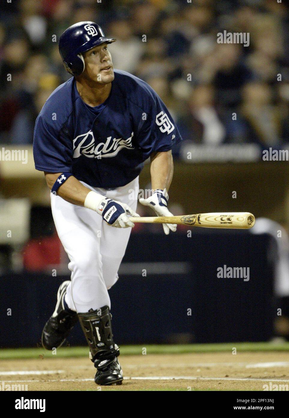 San Diego Padres' Brian Giles leaves the batter's box as he watches his ...