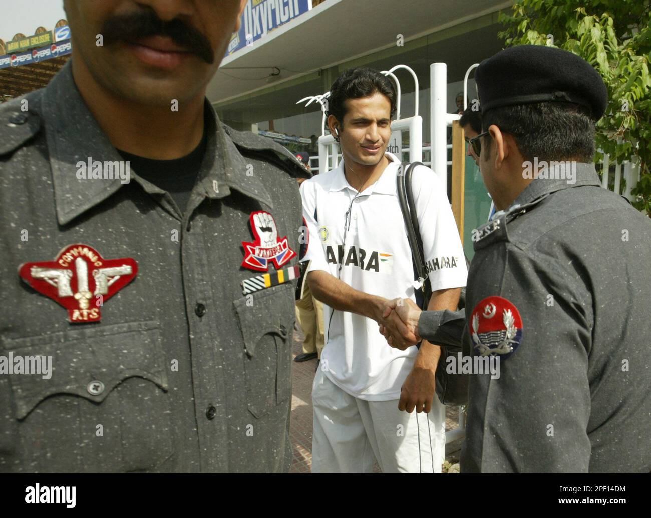 India's Irfan Pathan, cente,r shake hand with Pakistan Punjab Police ...