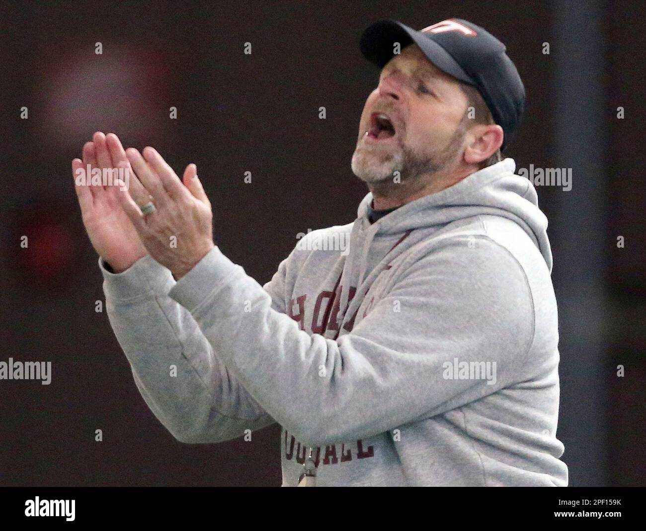 Virginia Tech head coach Brent Pry applauds a catch for a touchdown ...
