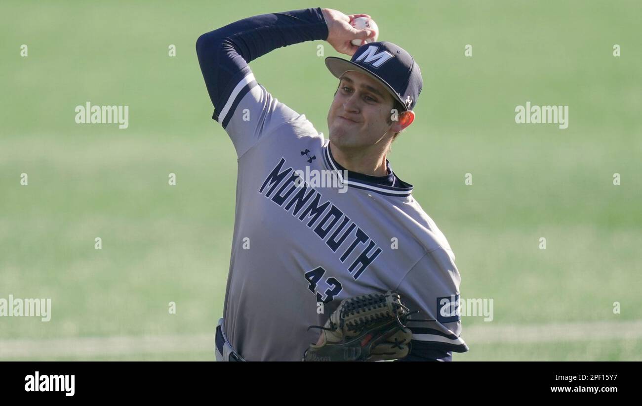 Monmouth pitcher Nick Tamburro winds up during an NCAA baseball game ...