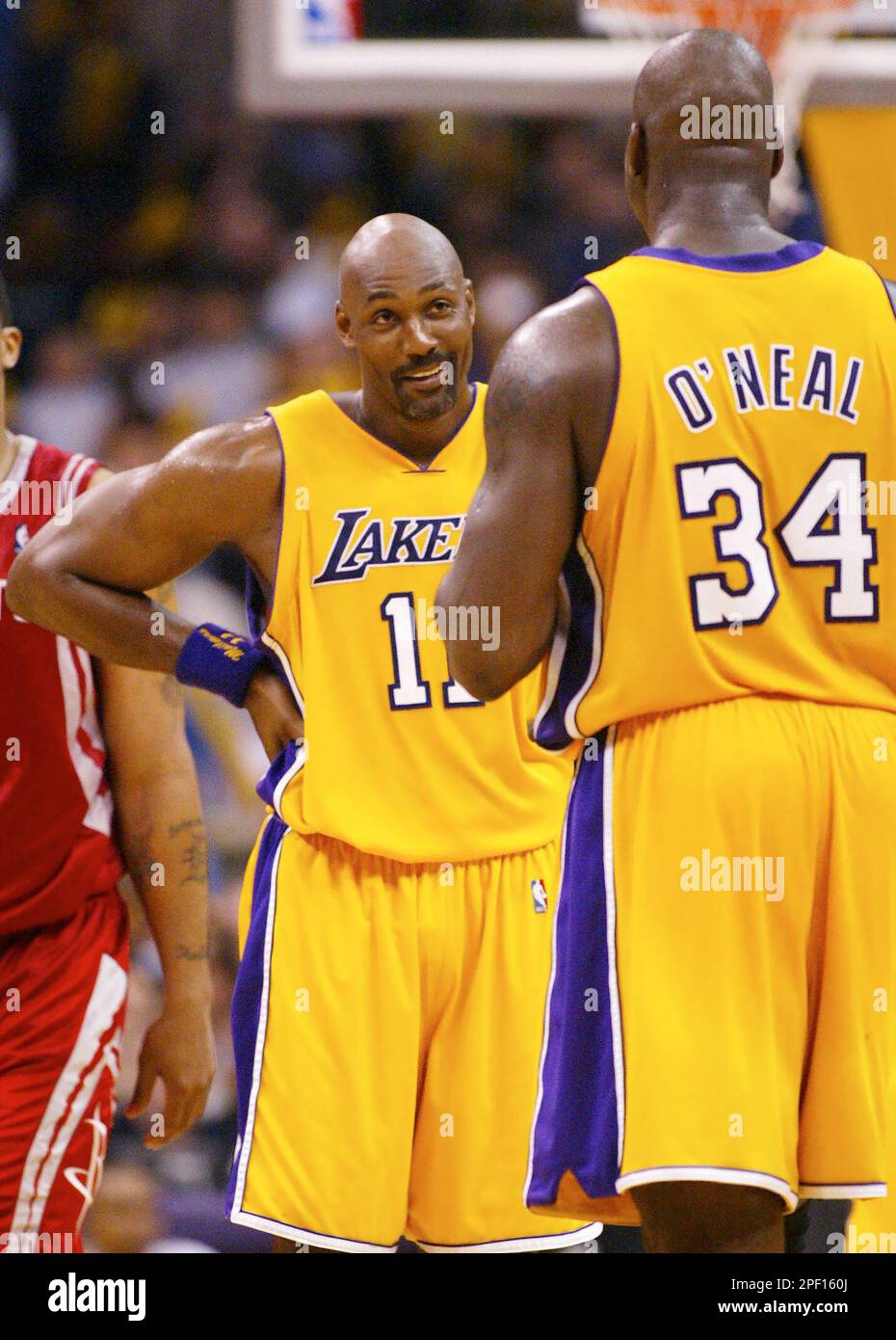 Los Angeles Lakers' Karl Malone, left, smiles at teammate Shaquille O ...