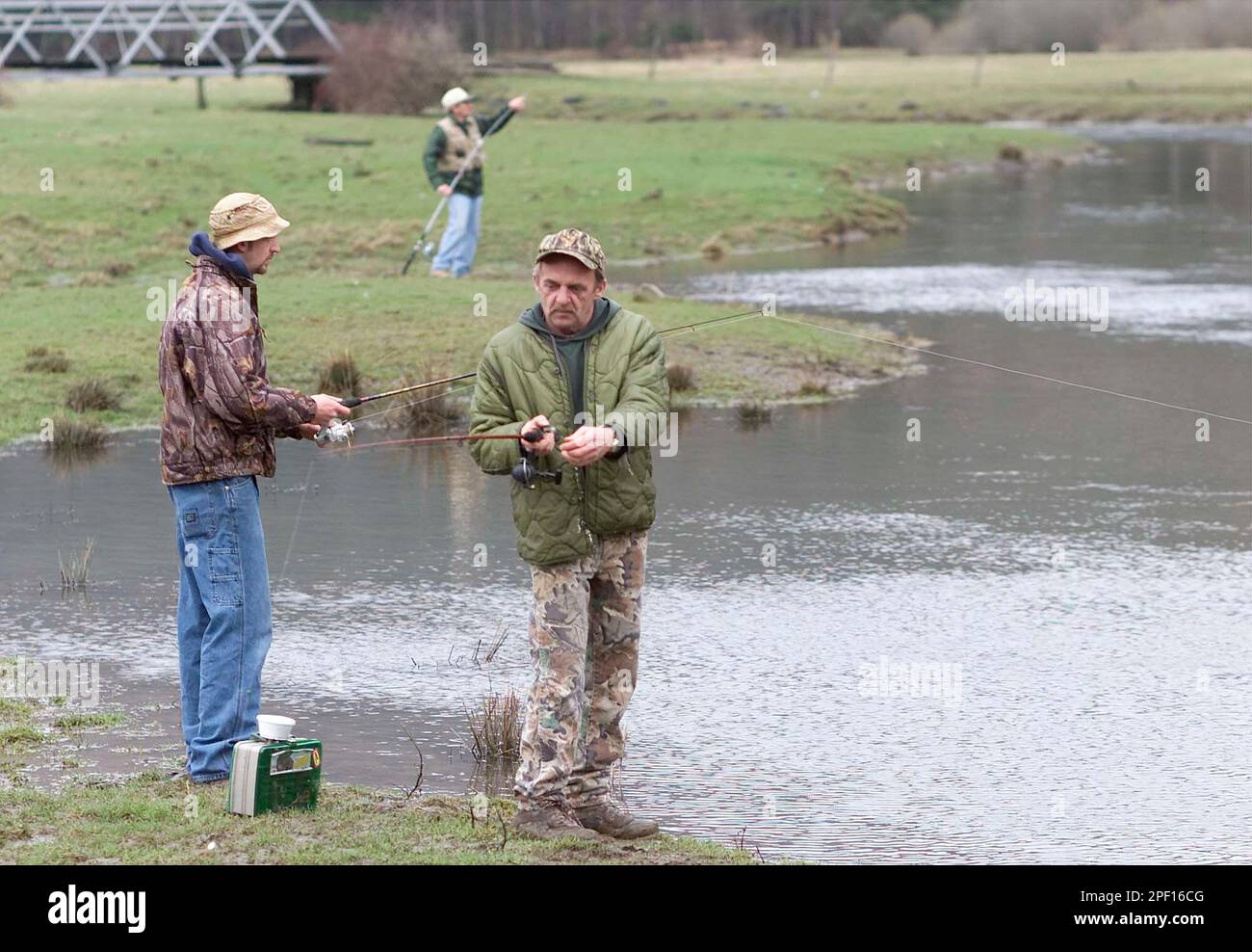 Richard Hoag Sr. gets ready to cast his line as his son, Richard Hoag ...