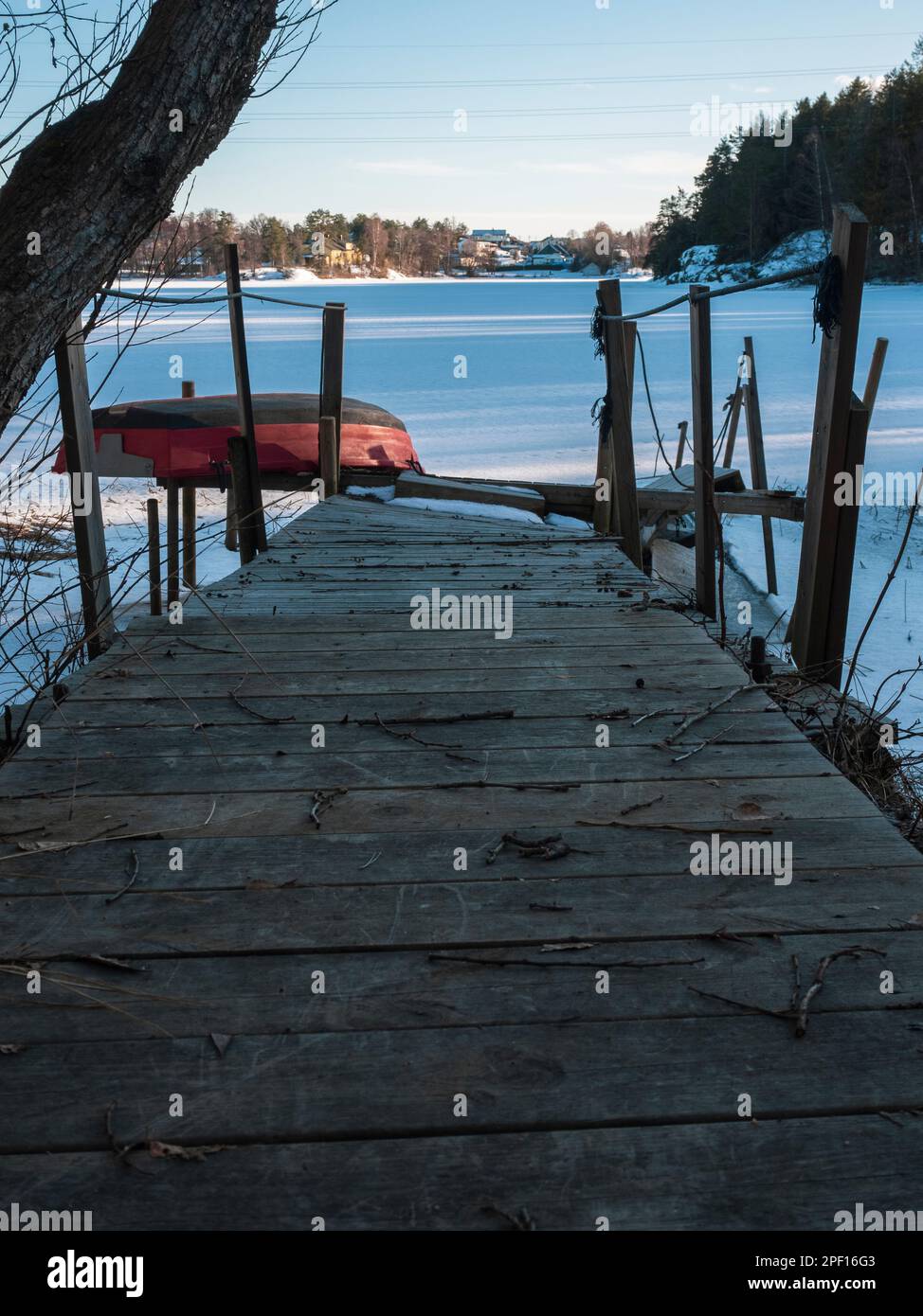 Cold and sunny landscape in Moss, Norway 2023. Sunset view with wooden ...