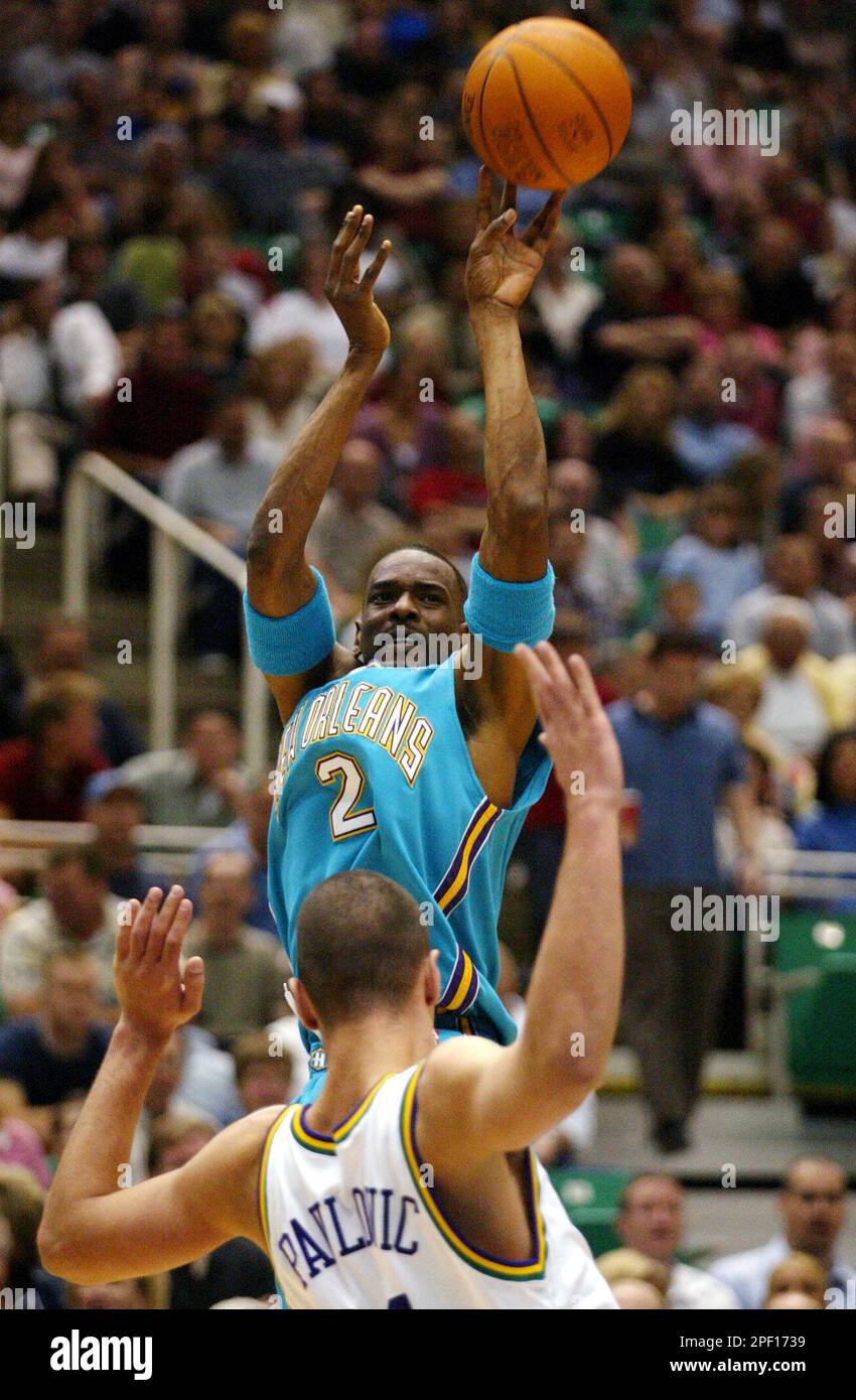 New Orleans Hornets forward Stacy Augmon shoots over Utah Jazz guard ...