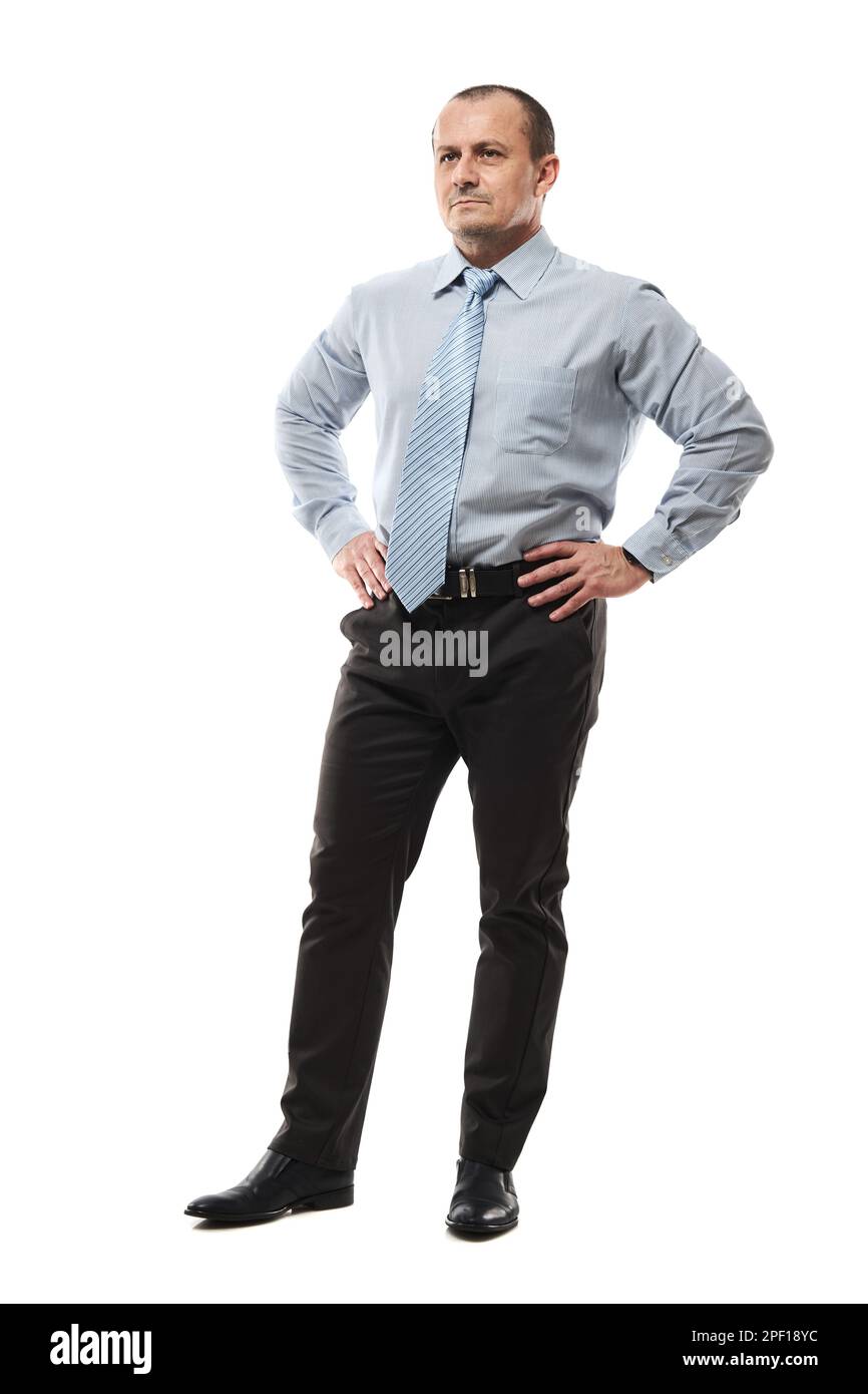 Confident businessman with hands on hips full body on white background ...
