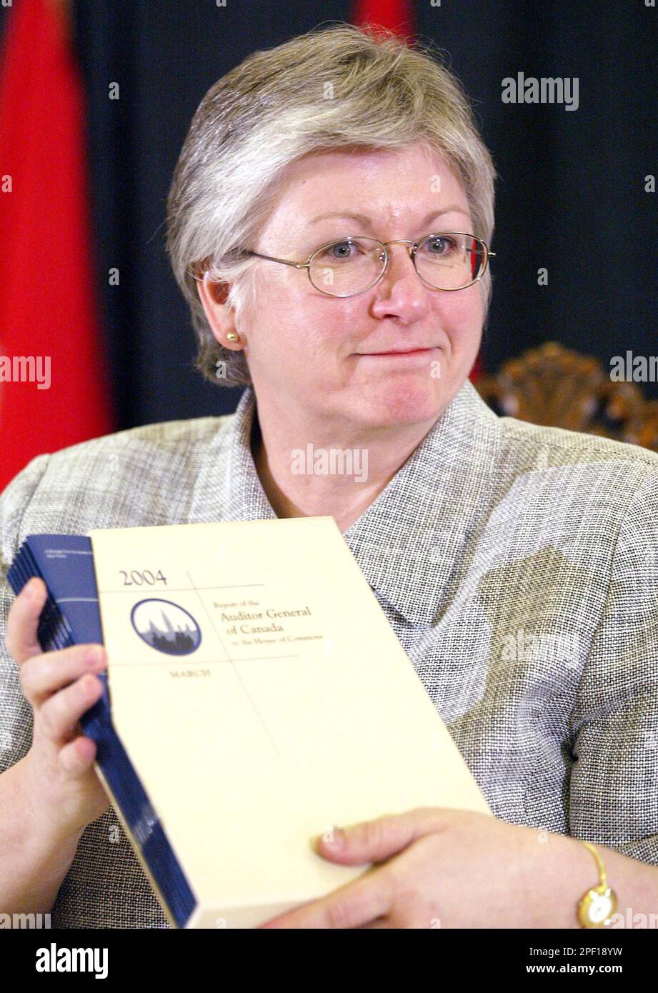 Canadian Auditor General Sheila Fraser holds up her March 2004 report ...